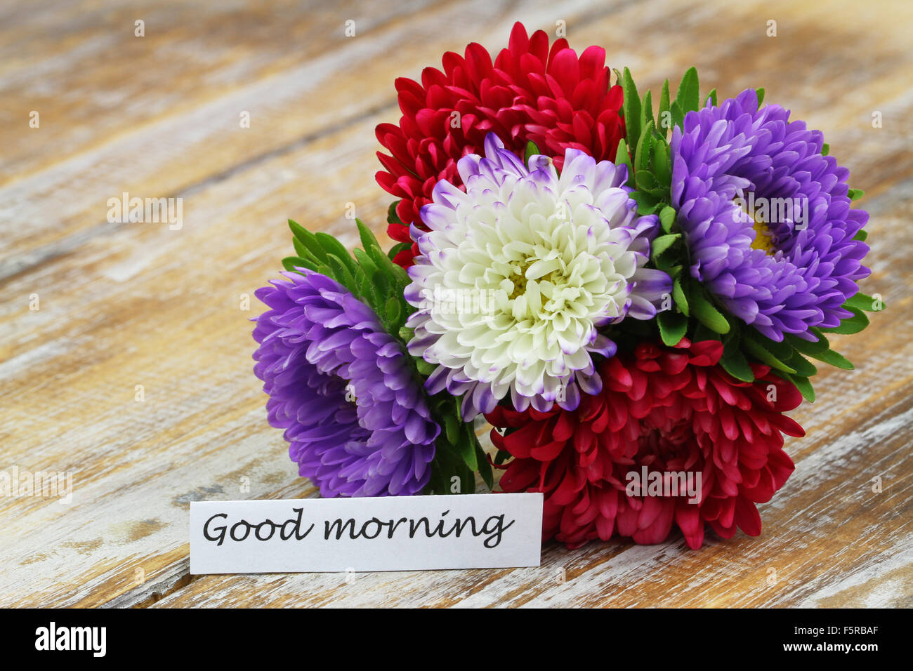 Good morning card with colorful bouquet of aster flowers on rustic ...