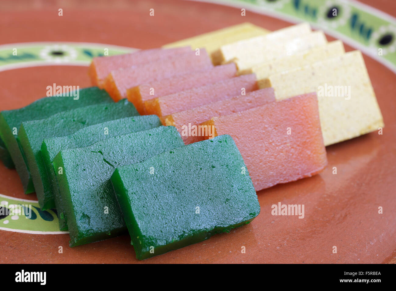 Slices of "ate", a fruit paste candy traditional to Morelia, Michoacan ...