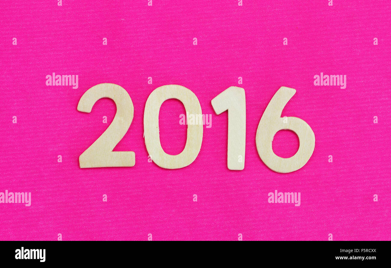 Number 2016 written with wooden letters on pink surface Stock Photo - Alamy