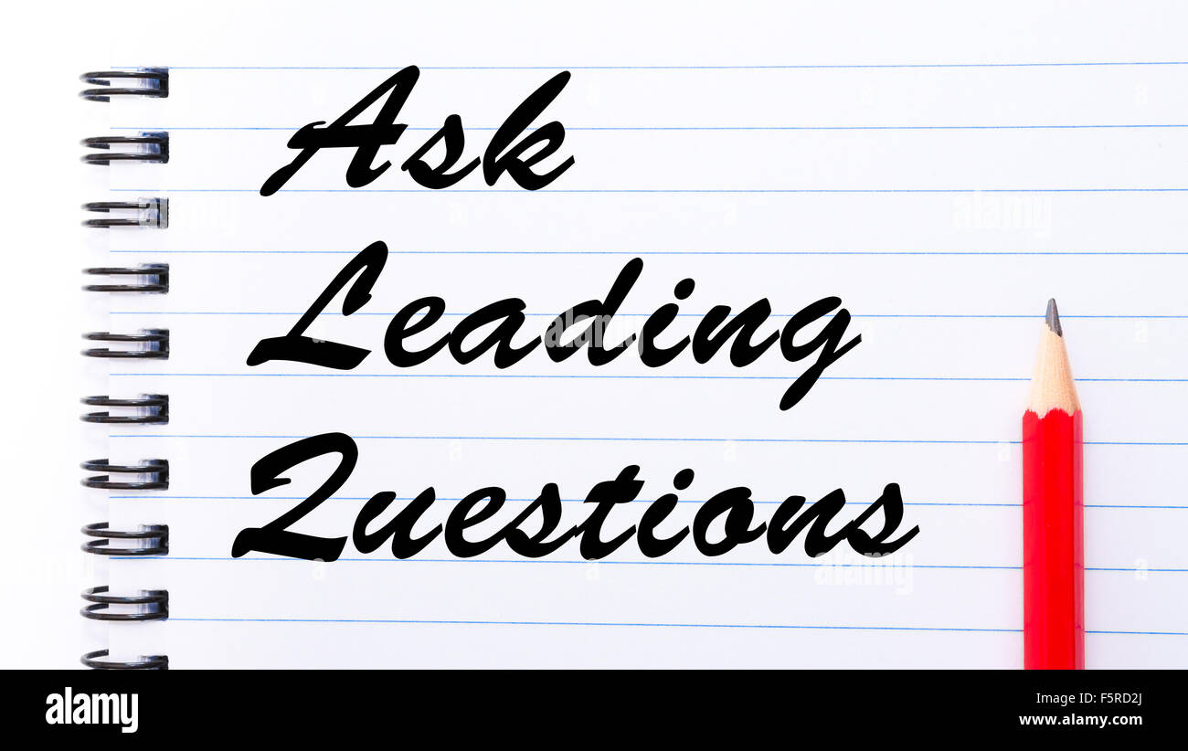Ask Leading Questions written on notebook page, red pencil on the right ...