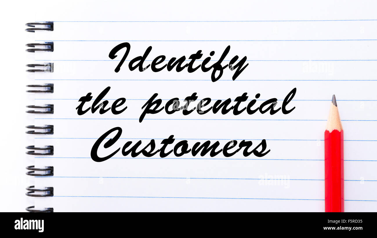 Identify the potential customers written on notebook page, red pencil ...