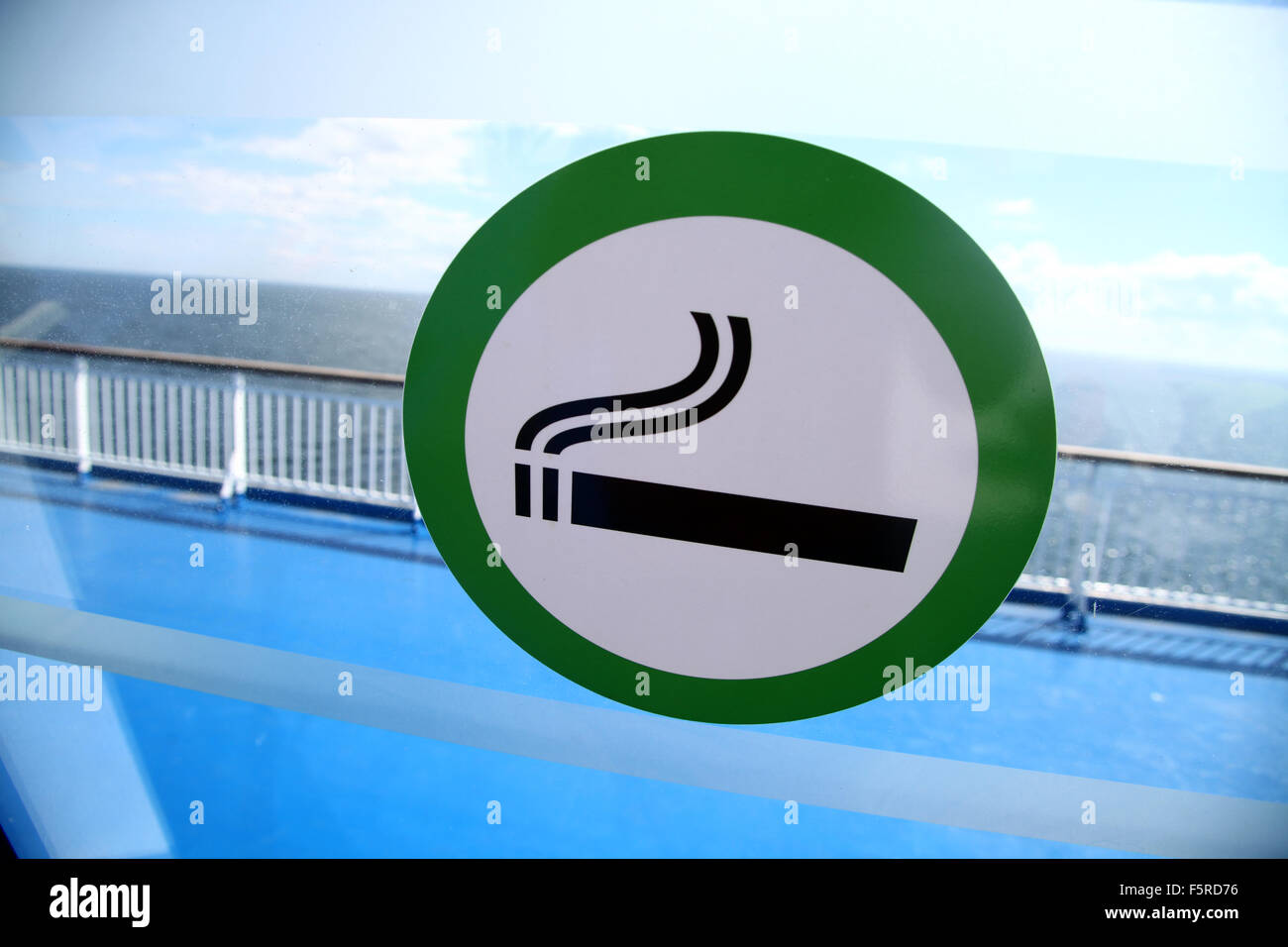 Picture of a sign marking the designated smoking area on a window Stock ...