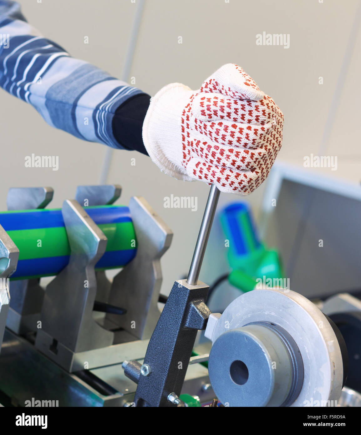 Mechanics hand pushing lever of machine Stock Photo - Alamy