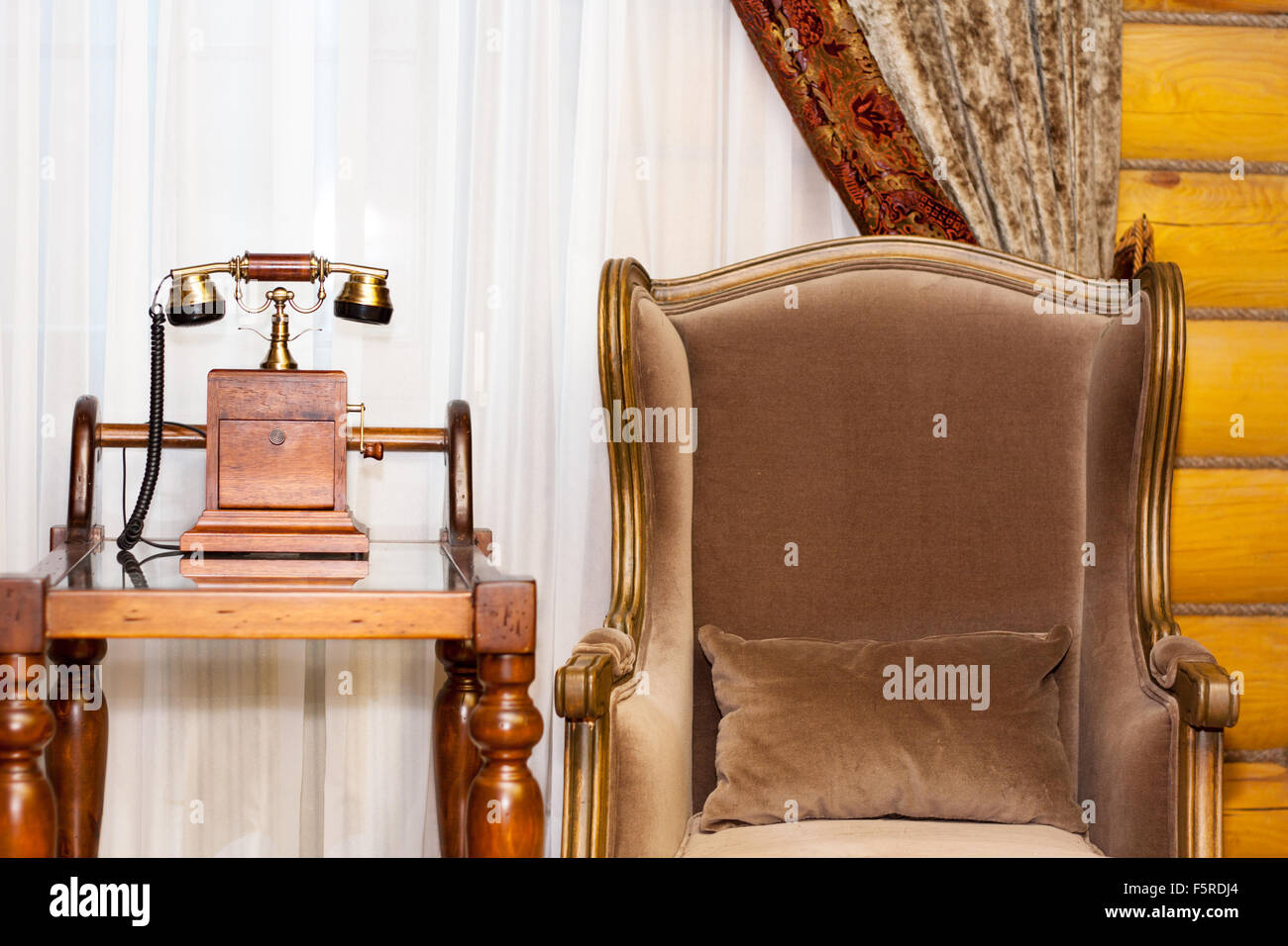 Vintage interior - telephone and armchair Stock Photo - Alamy
