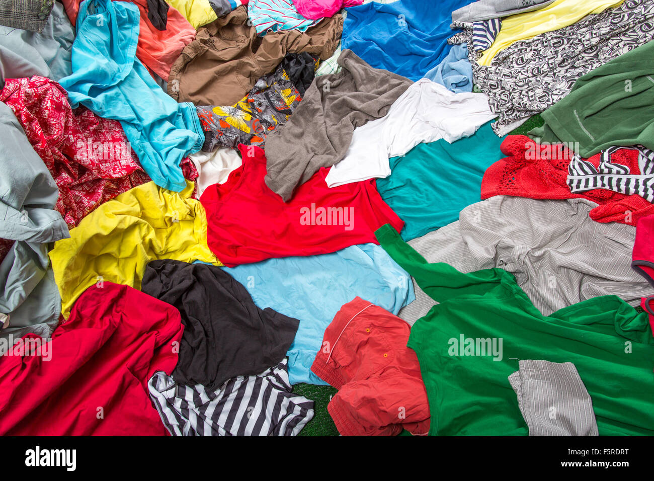 Bright messy multicolored clothing. Background or texture Stock Photo ...