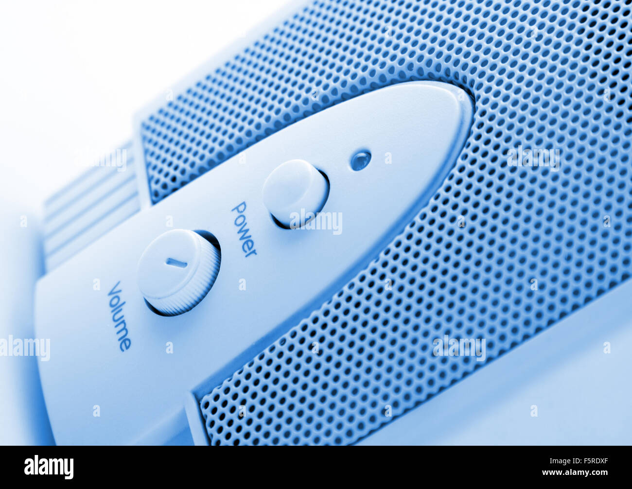 Close-up view of computer loudspeaker. Toned in blue Stock Photo - Alamy