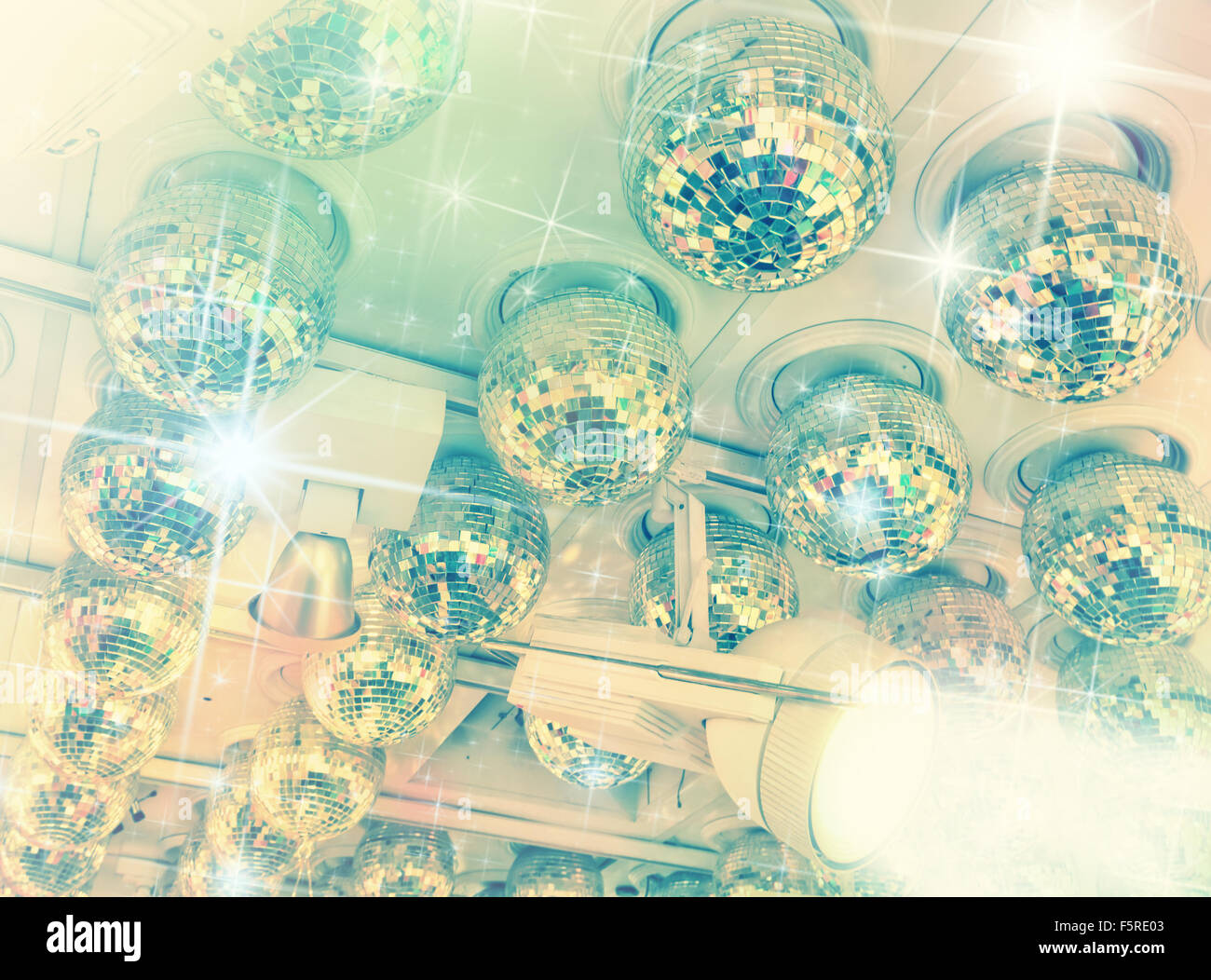 Many disco balls on ceiling in a nightclub Stock Photo - Alamy