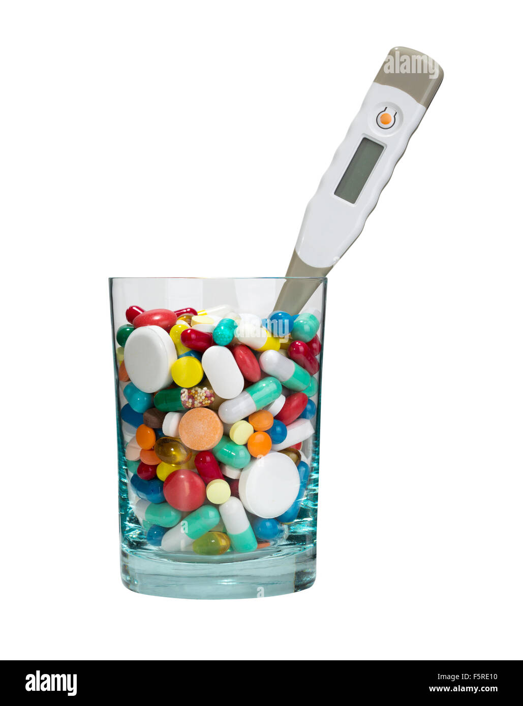 Medical cocktail - glass full of pills and thermometer. Isolated Stock ...