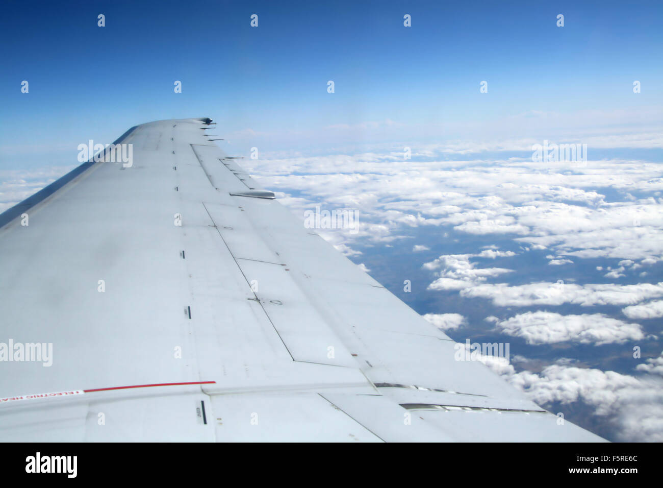 View of long airplane wing from window Stock Photo - Alamy