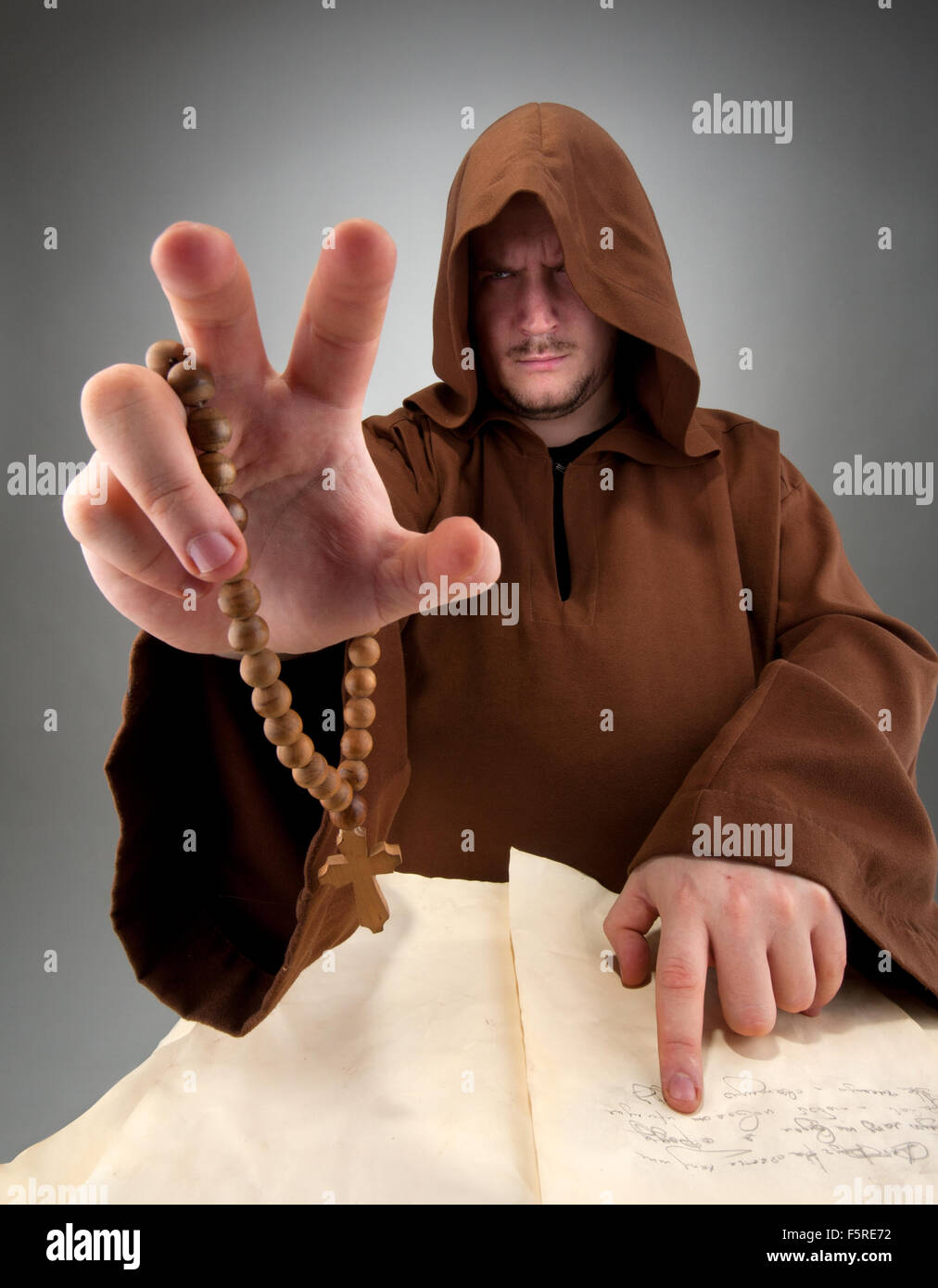 Portrait of magician reading the spell from old book Stock Photo - Alamy