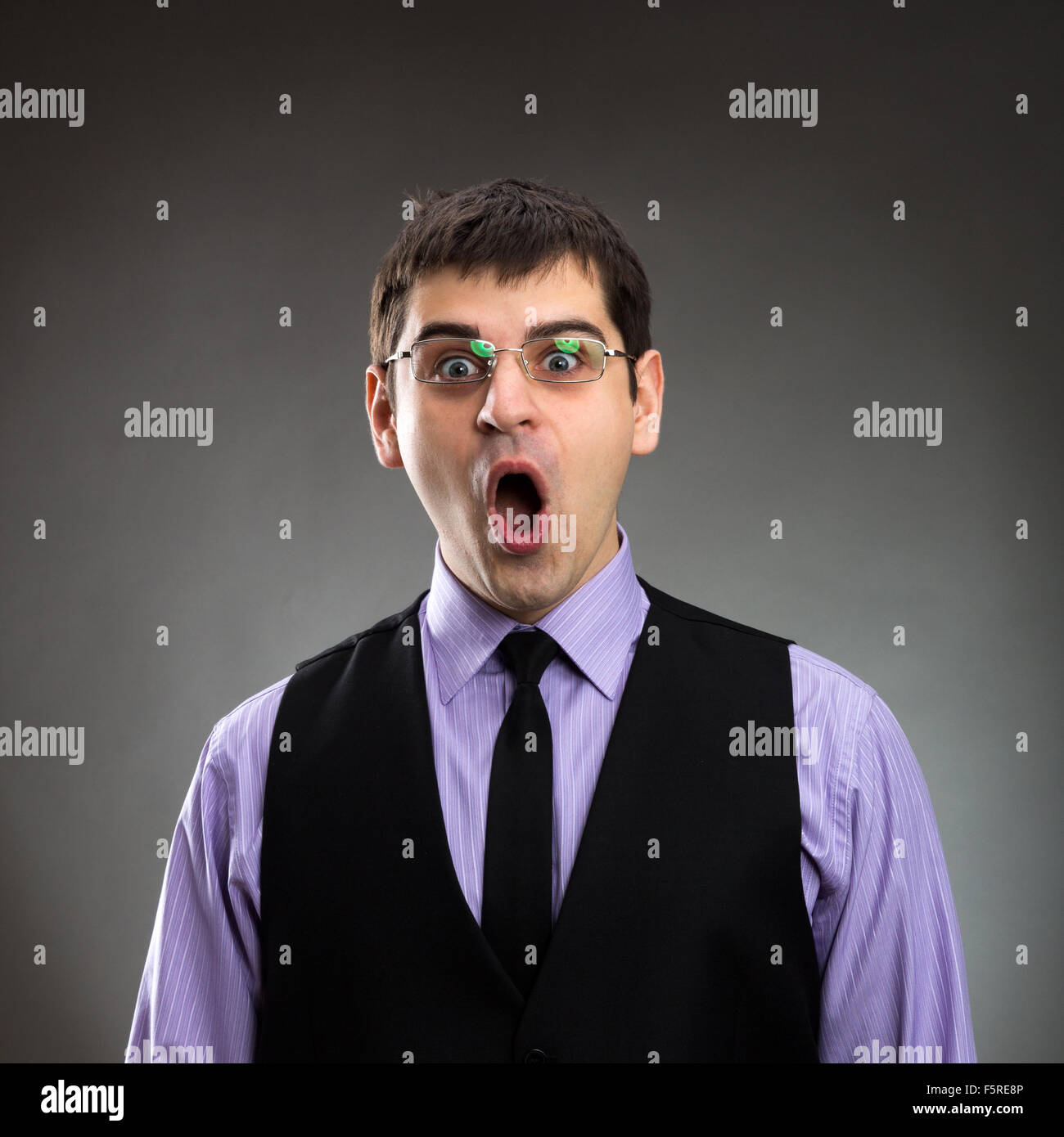 Businessman with open mouth. Man grimacing Stock Photo - Alamy