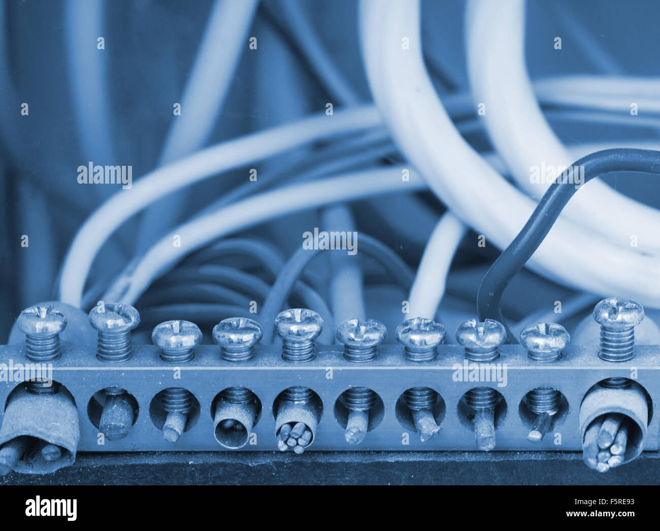 Power lines in electrical strip. Toned in blue Stock Photo - Alamy