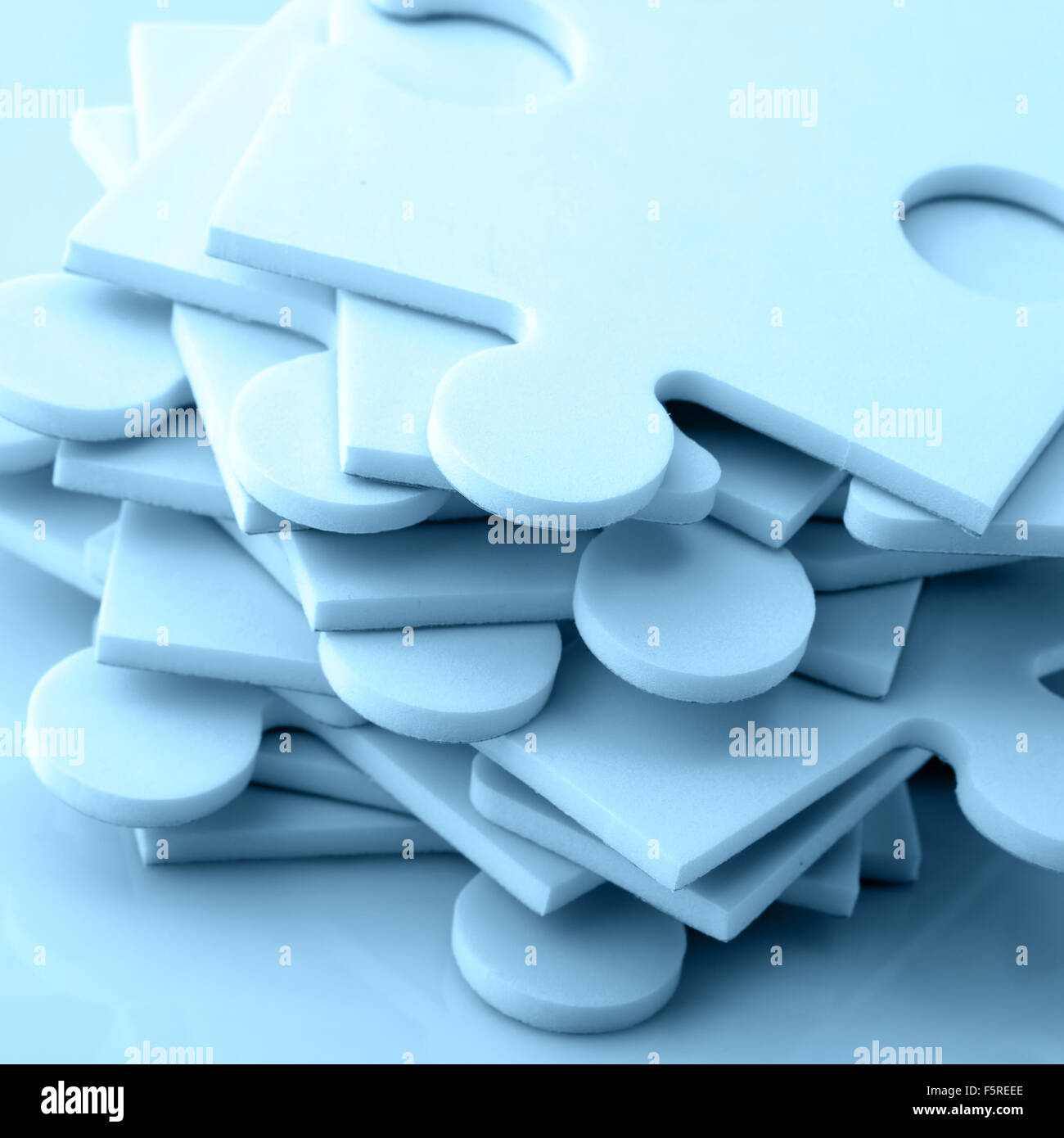 Stack of jigsaw puzzle pieces Stock Photo - Alamy