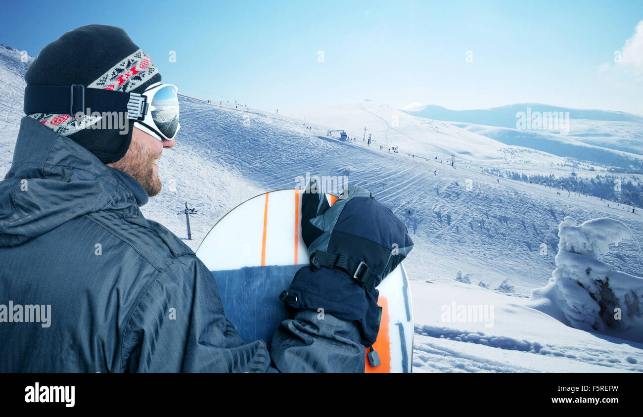 Snowboarder standing from back view Stock Photo - Alamy