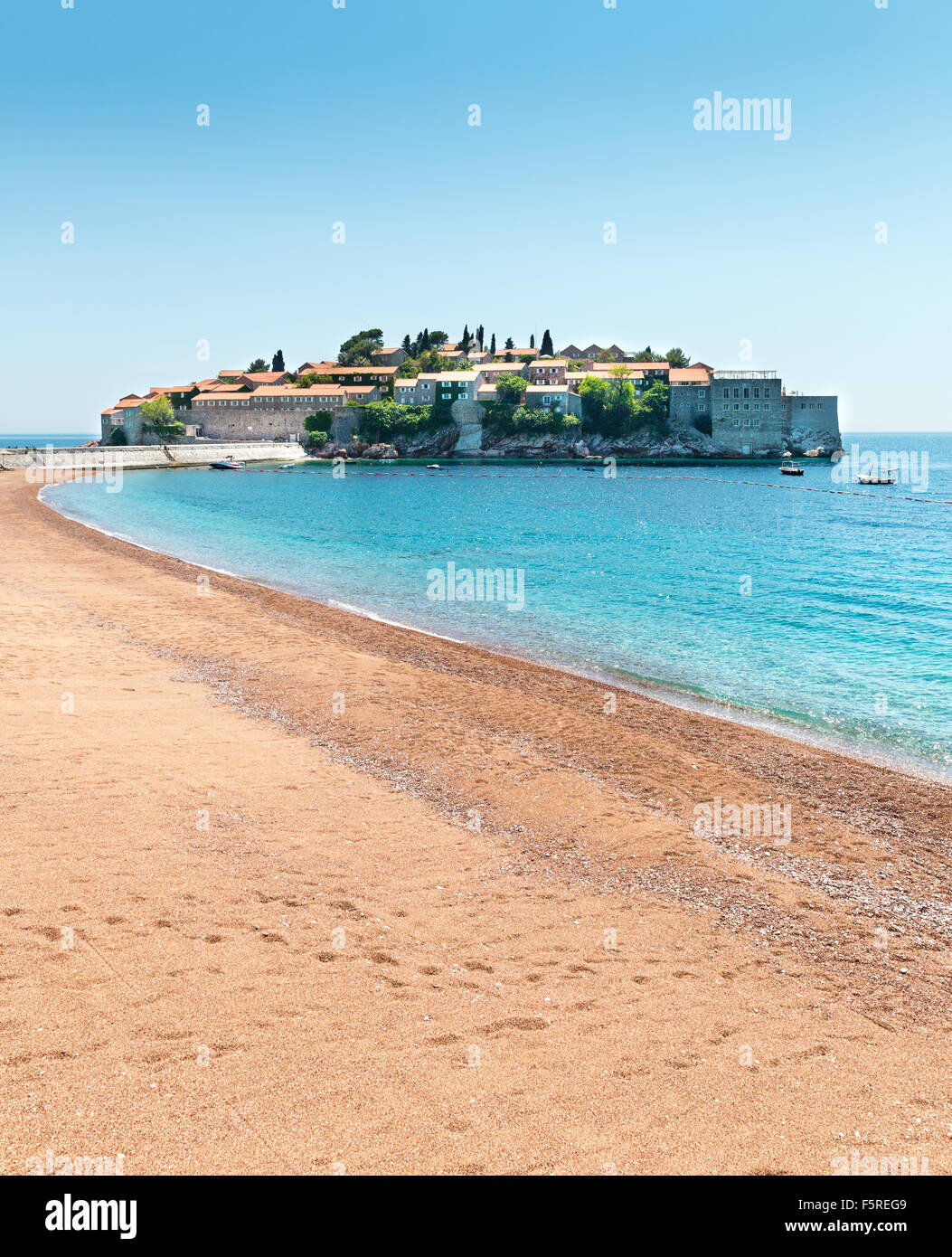 Nice sandy beach against an old town island Stock Photo - Alamy