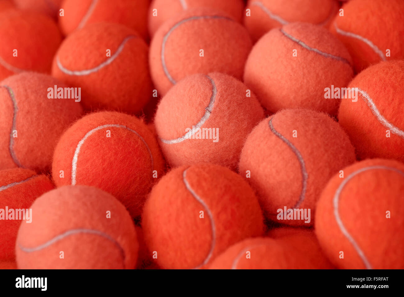 exotic red tennis ball as sport background Stock Photo - Alamy