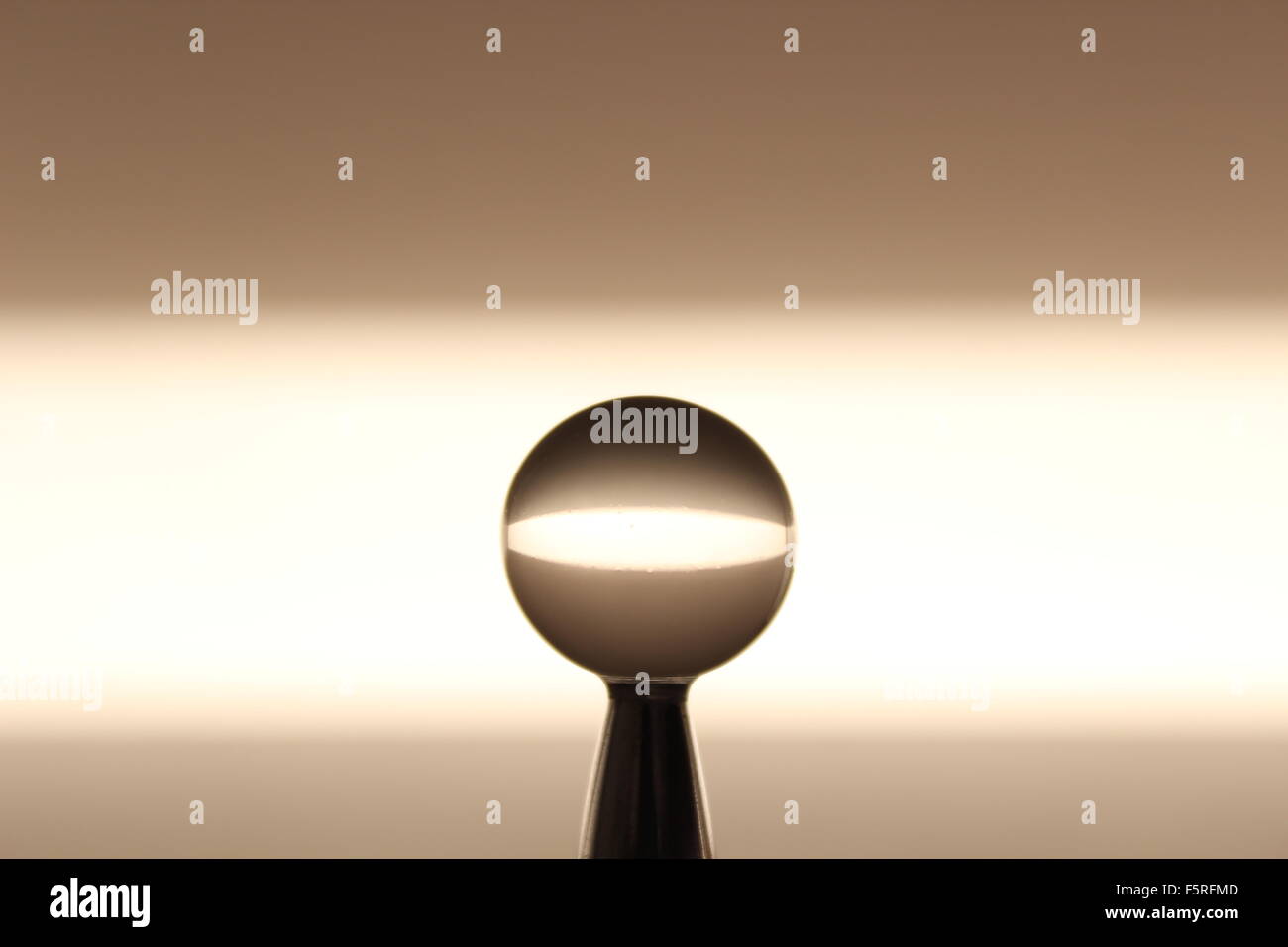Sphere in front a bright background Stock Photo - Alamy