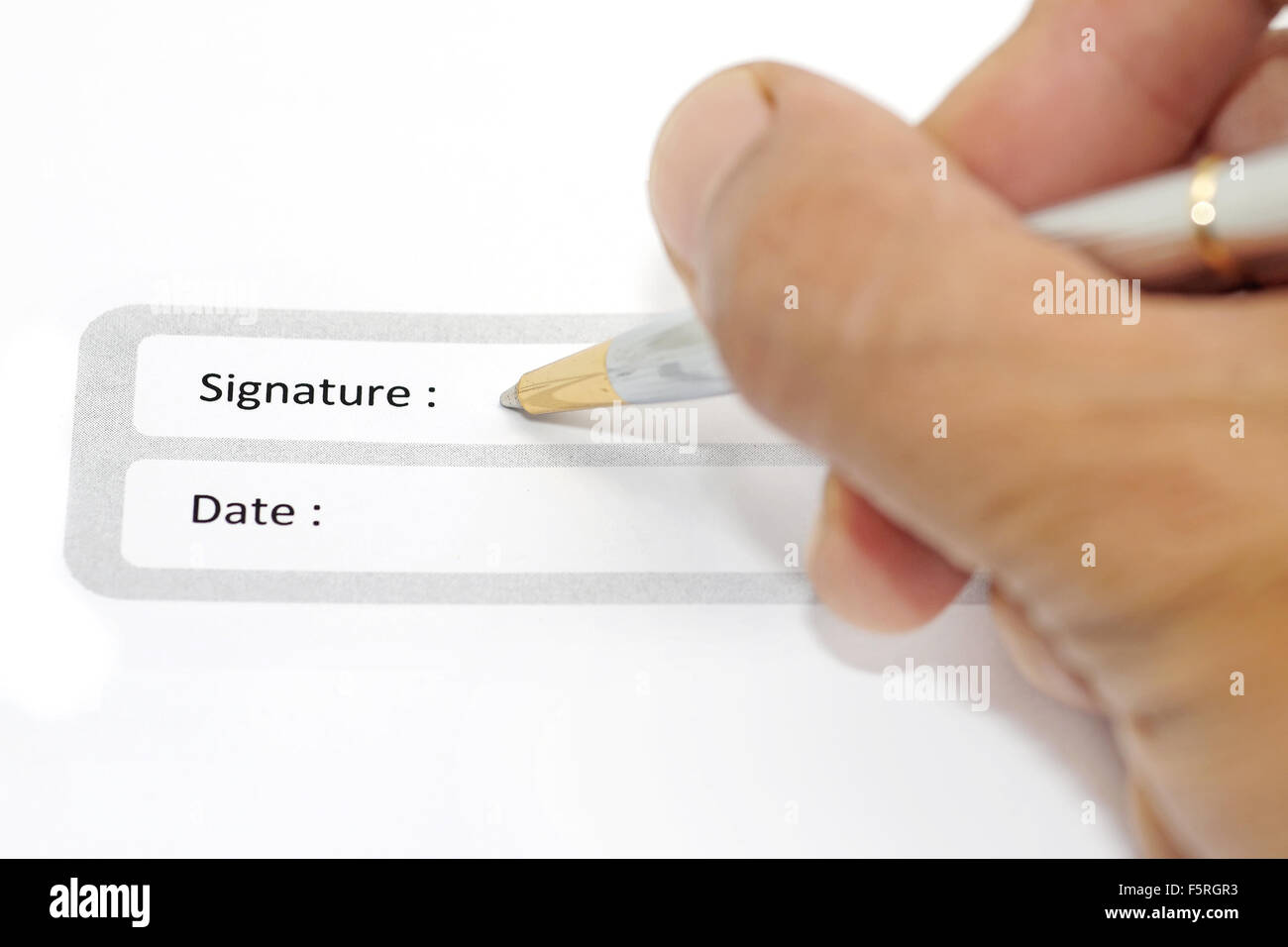 signature field on document with pen and human hand Stock Photo - Alamy