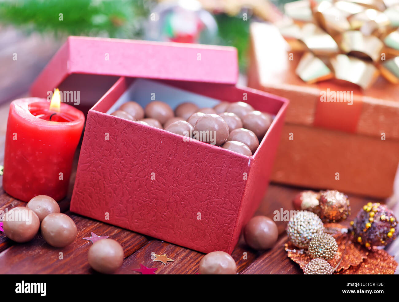 chocolate candy in box and on a table Stock Photo - Alamy