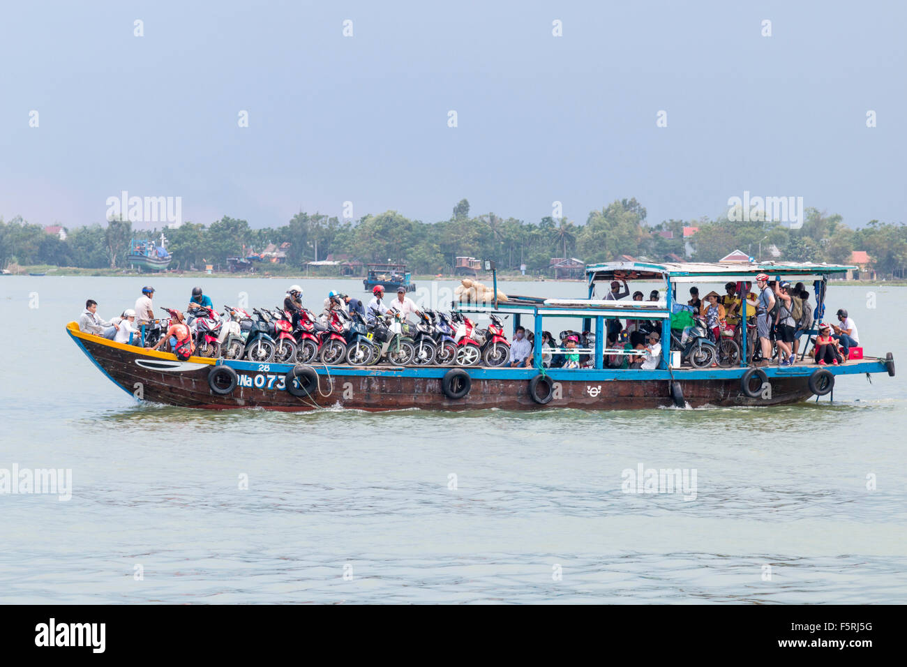 Hoi An , central coast of Vietnam, vietnamese ferry boat loaded with ...