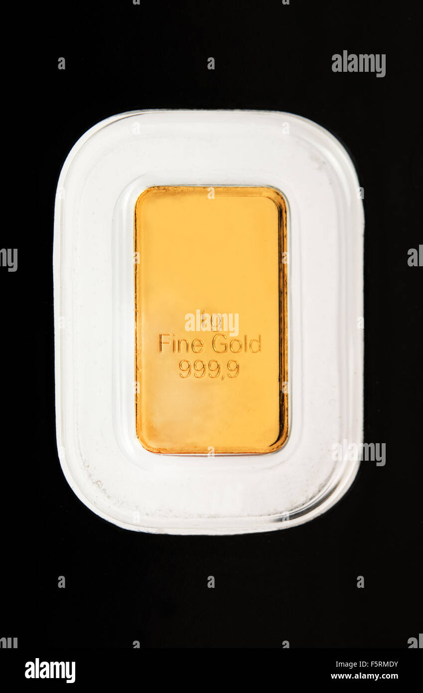 photo of a 1g gold bar isolated on a black background Stock Photo - Alamy