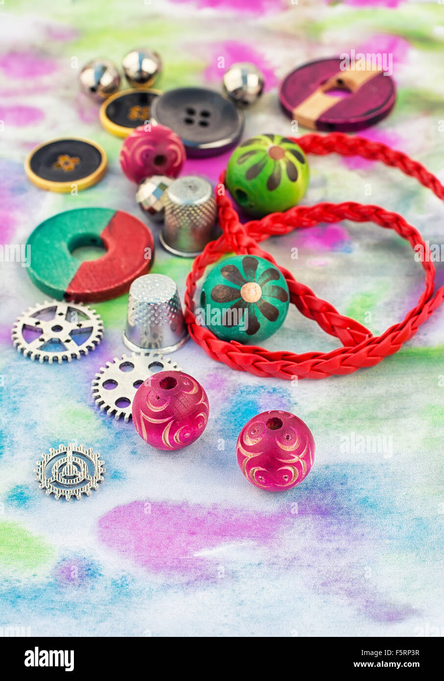 spool of thread with beads and accessories for needlework on bright ...