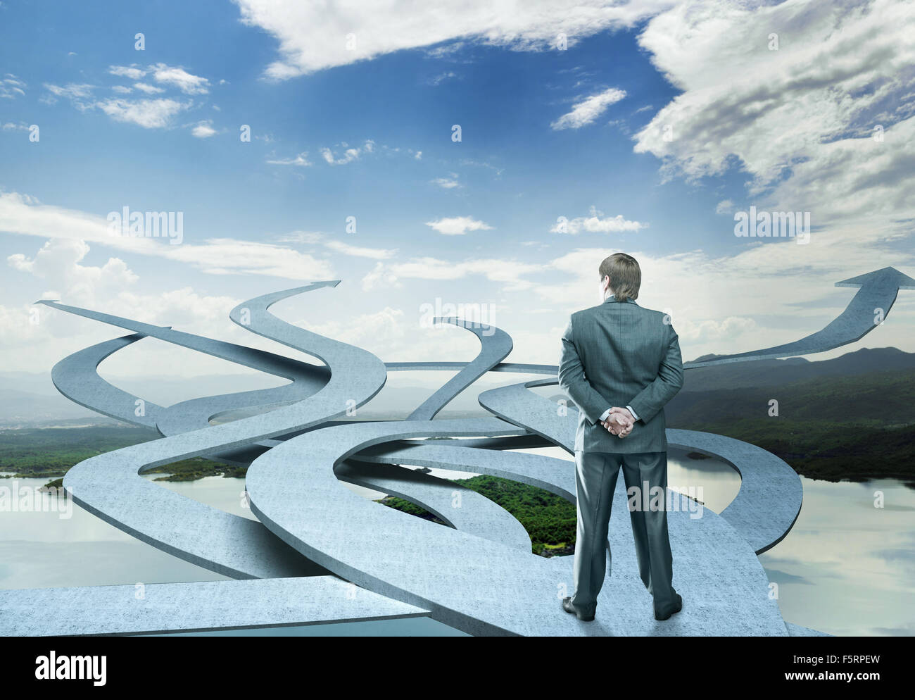 Businessman is choosing his way on nature background Stock Photo - Alamy
