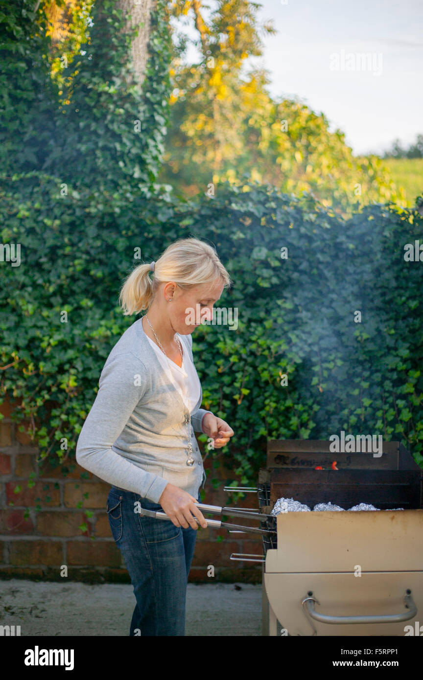 Middle aged woman relaxing in backyard hi-res stock photography and ...