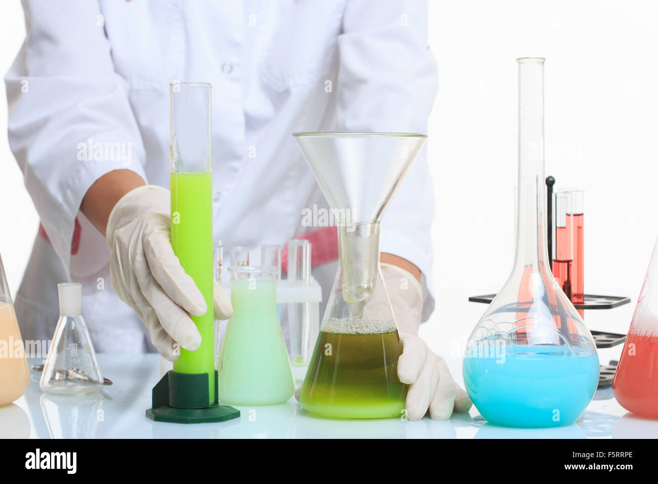 hands holding test tubes with chemical elements Stock Photo - Alamy