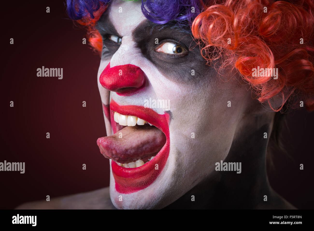 Evil Spooky Clown Portrait on dark background. expressive man Stock ...