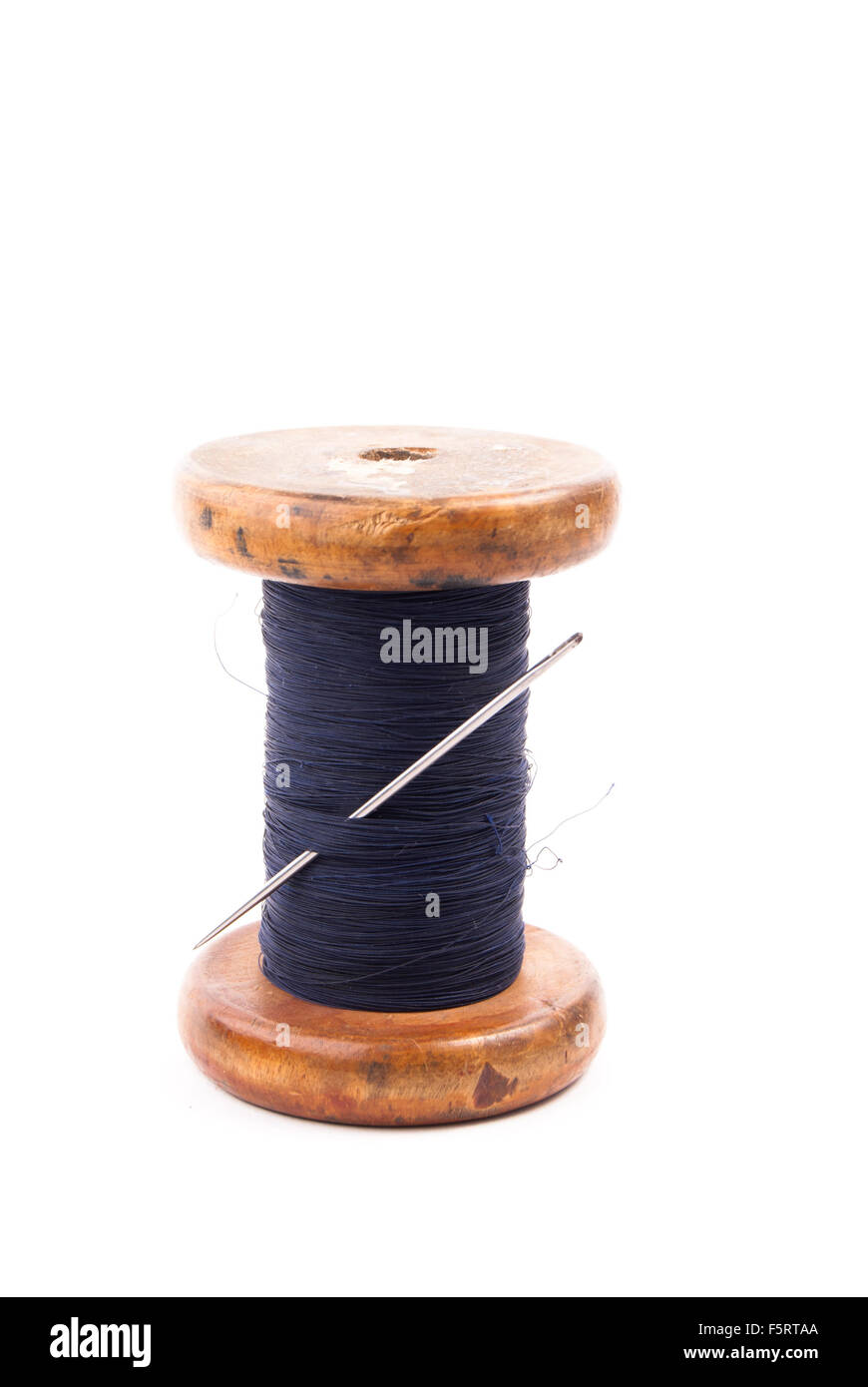 spool of thread with needle Stock Photo - Alamy