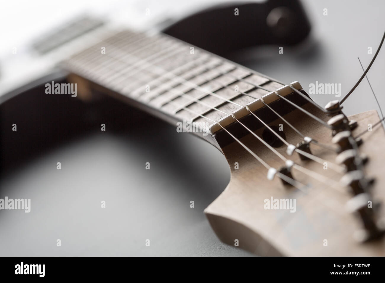 Electric guitar fretboard with strings. Shallow depth of field Stock ...