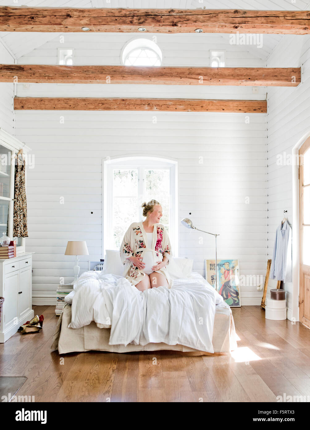 35 40 woman sitting bed hi-res stock photography and images - Alamy