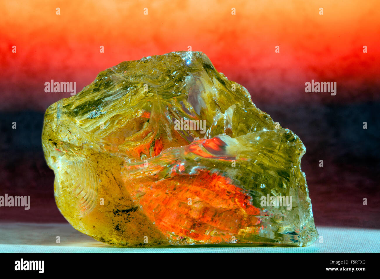 Yellow crystal mineral stone in studio setting Stock Photo - Alamy