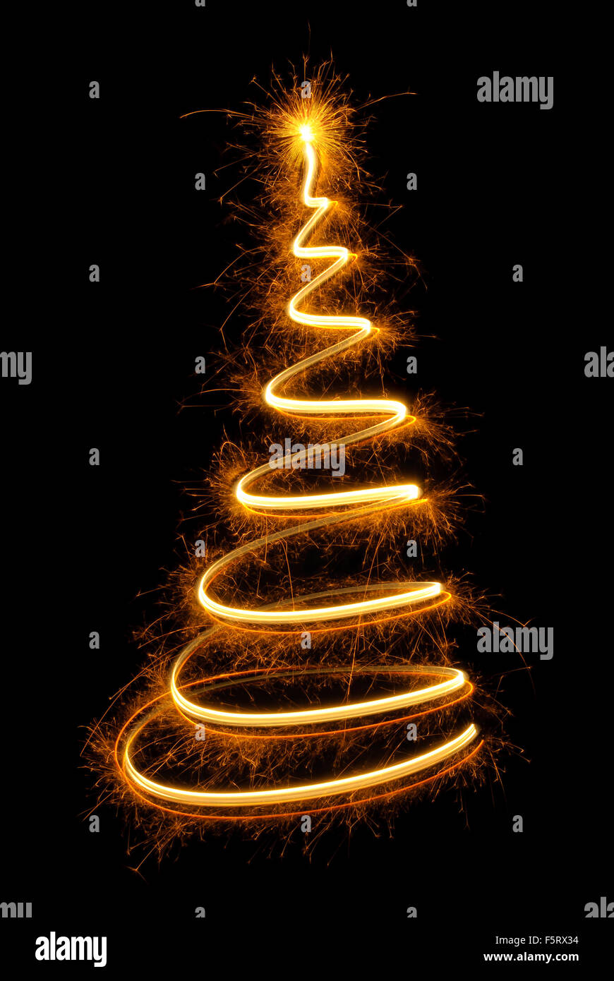 Sparkling spiral as a magical Christmas tree with glowing top on black ...
