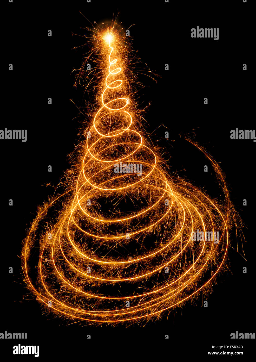 Sparkling spiral as a magical Christmas tree with glowing top on black ...