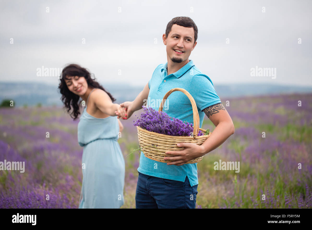 Young couple harvesting lavender flowers Stock Photo - Alamy