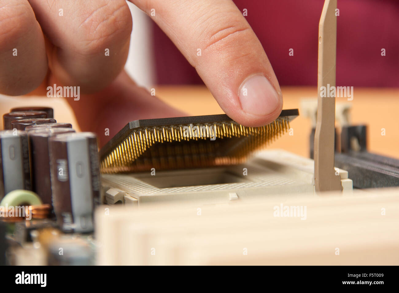 Installing computer processor to motherboard Stock Photo - Alamy