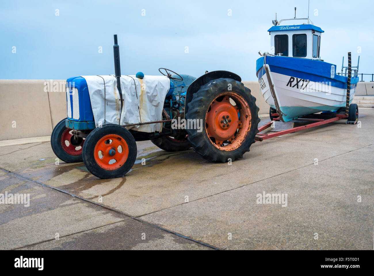 A small inshore fishing boat with its launching tractor on Redcar ...
