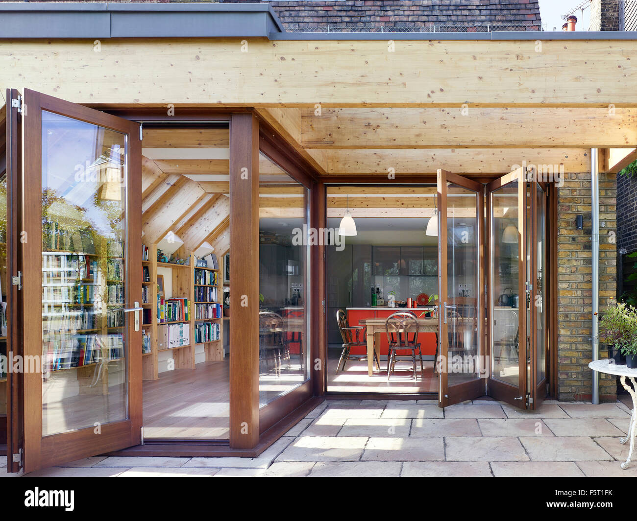 Timber frame of extension with concertina doors. Wendell Rd, London ...