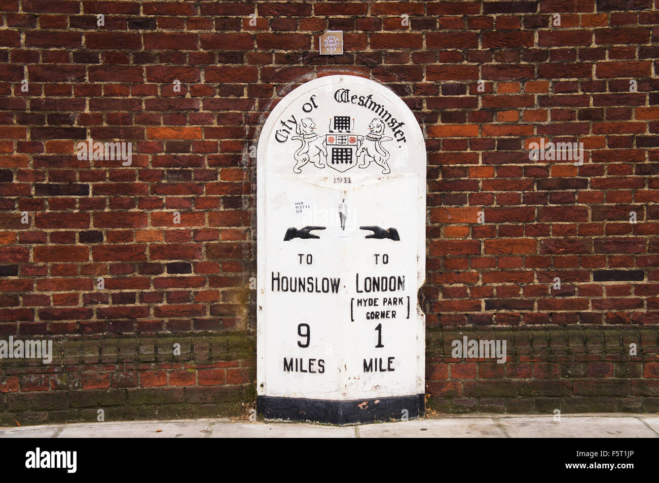 Signpost, guide-post at Exhibition Road, City of Westminster, brick ...
