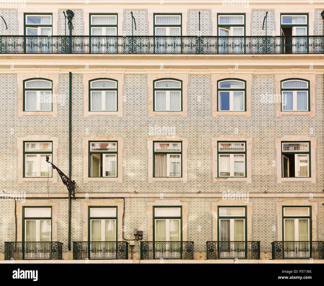 Building wall with windows and balconies background Stock Photo - Alamy