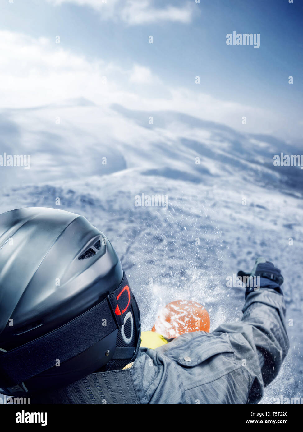 Mountain-skier jump from back view Stock Photo - Alamy