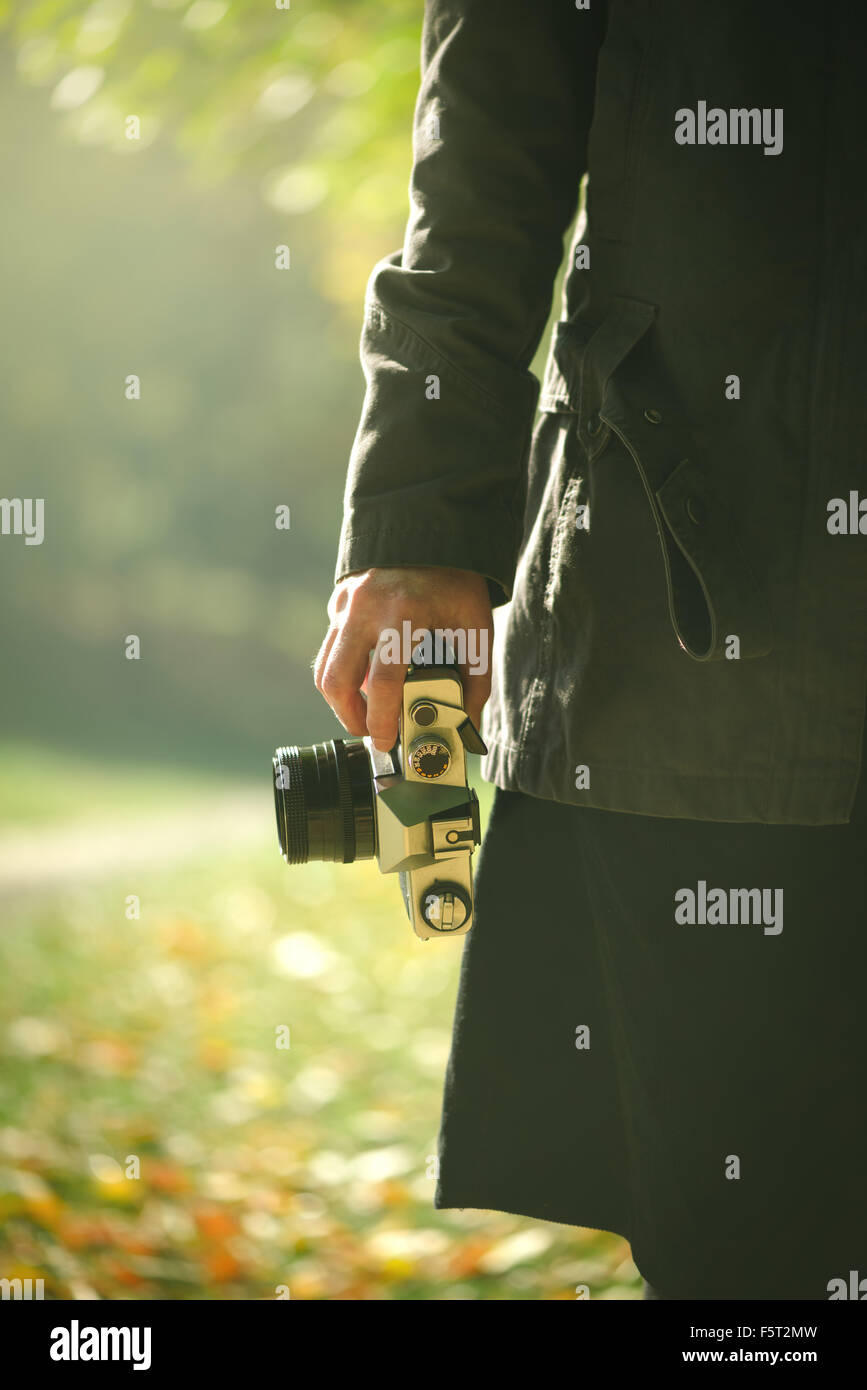 Hipster female photographer exploring autumn naturescenery and ...