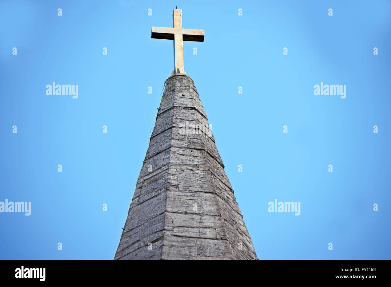 church spire cross in gold against blue sky Stock Photo - Alamy