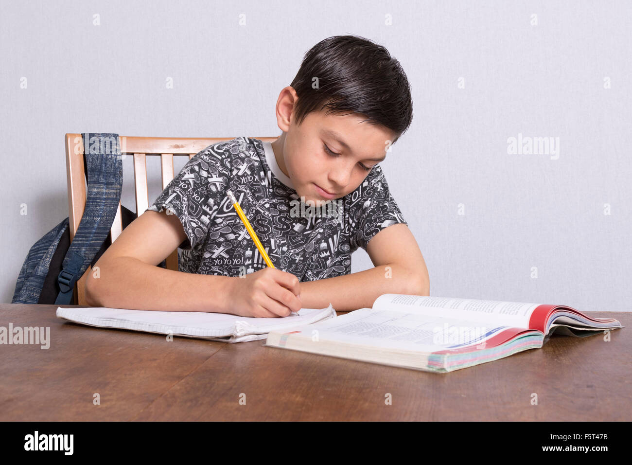 Pre-teen boy doing his homework Stock Photo - Alamy