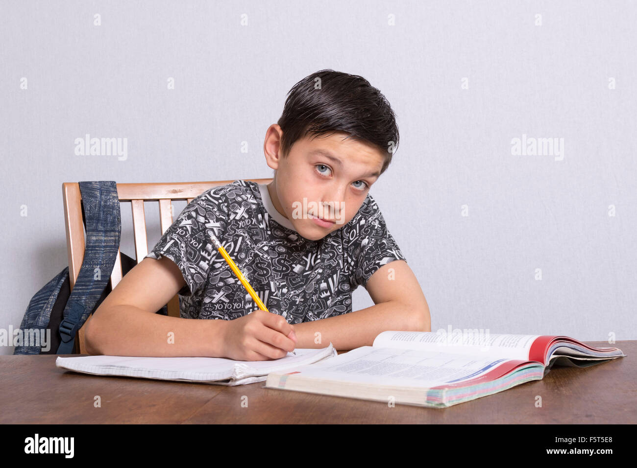 Pre-teen boy doing his homework Stock Photo - Alamy