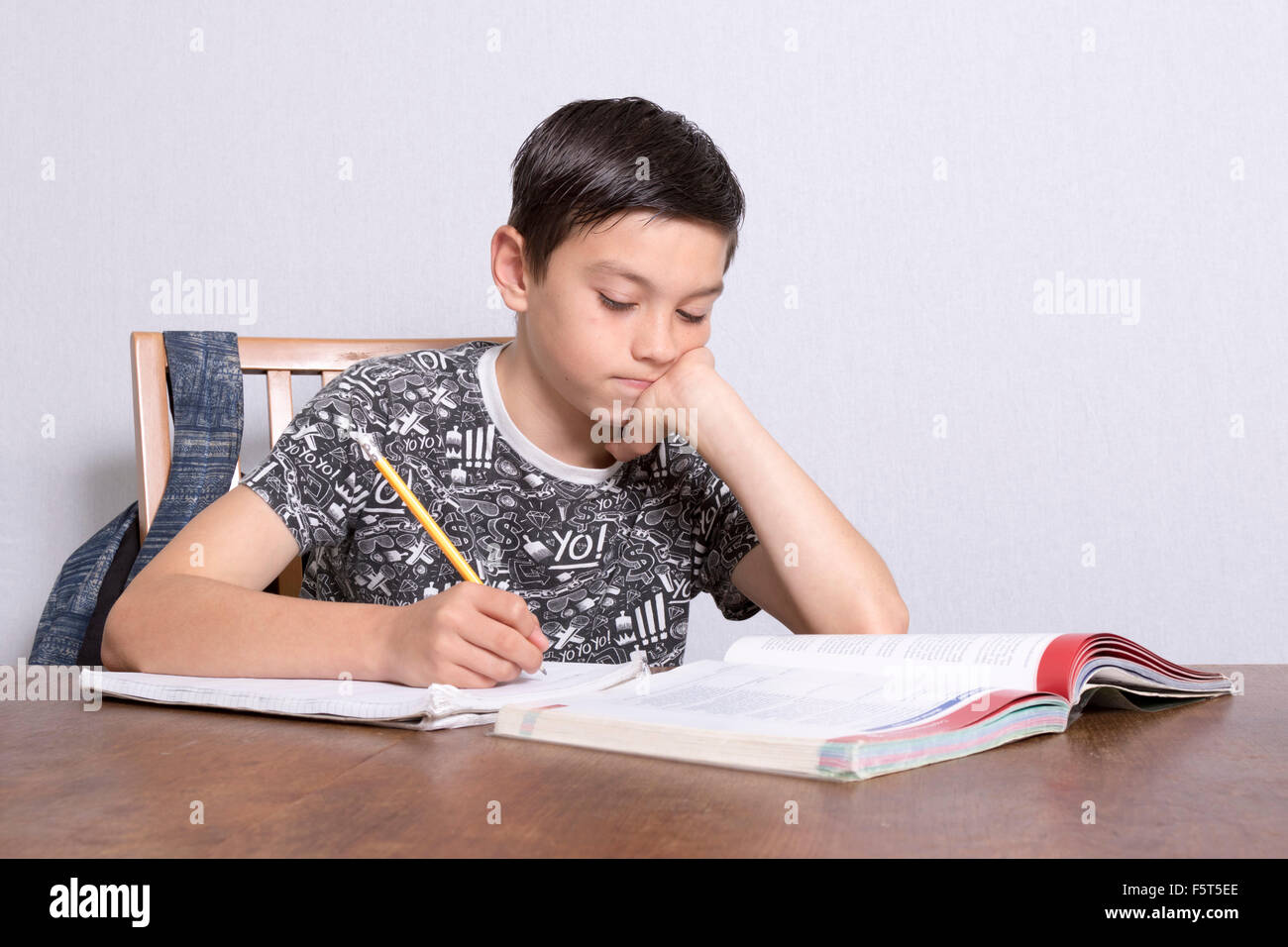 Pre-teen boy doing his homework Stock Photo - Alamy