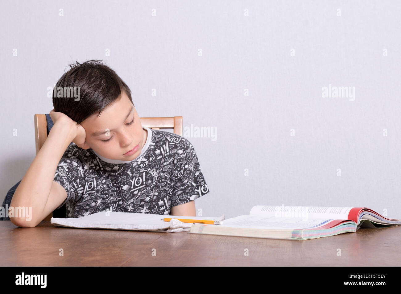 Pre-teen boy doing his homework Stock Photo - Alamy