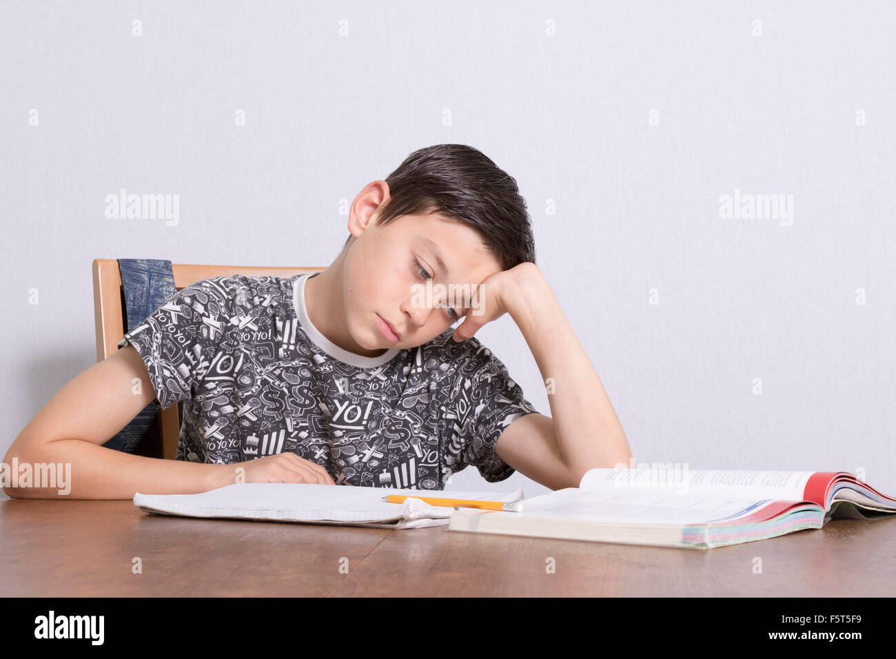 Pre-teen boy doing his homework Stock Photo - Alamy